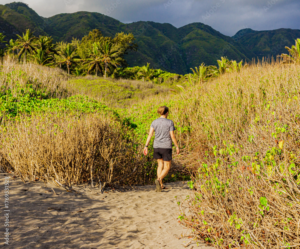 Female Tourist Entering Trail on The Shore of Kawilli Beach and Halawa ...