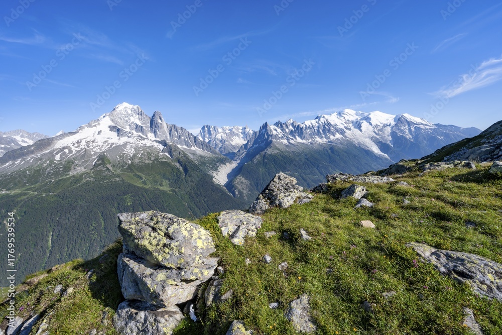 Photo Stock Mountain meadow and mountain panorama, mountain peaks ...