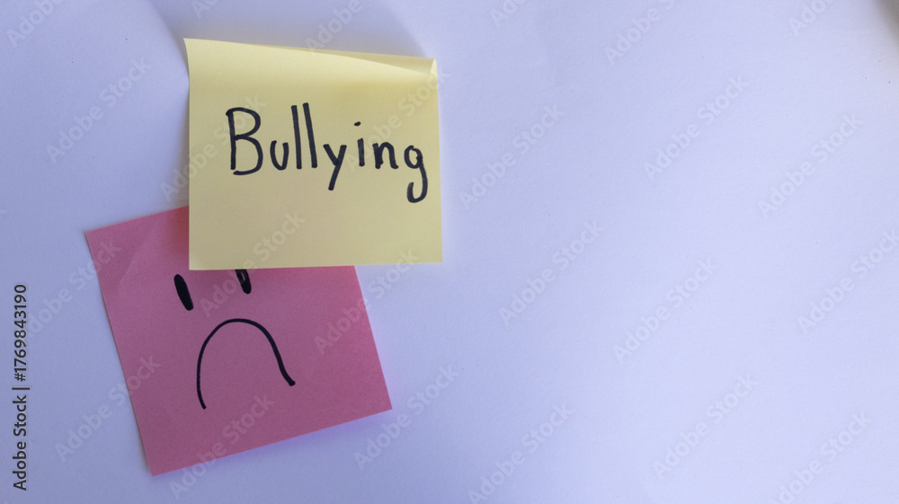 Handwritten 'Bullying' Word and Sad Face Icon on Sticky Notes for Anti ...