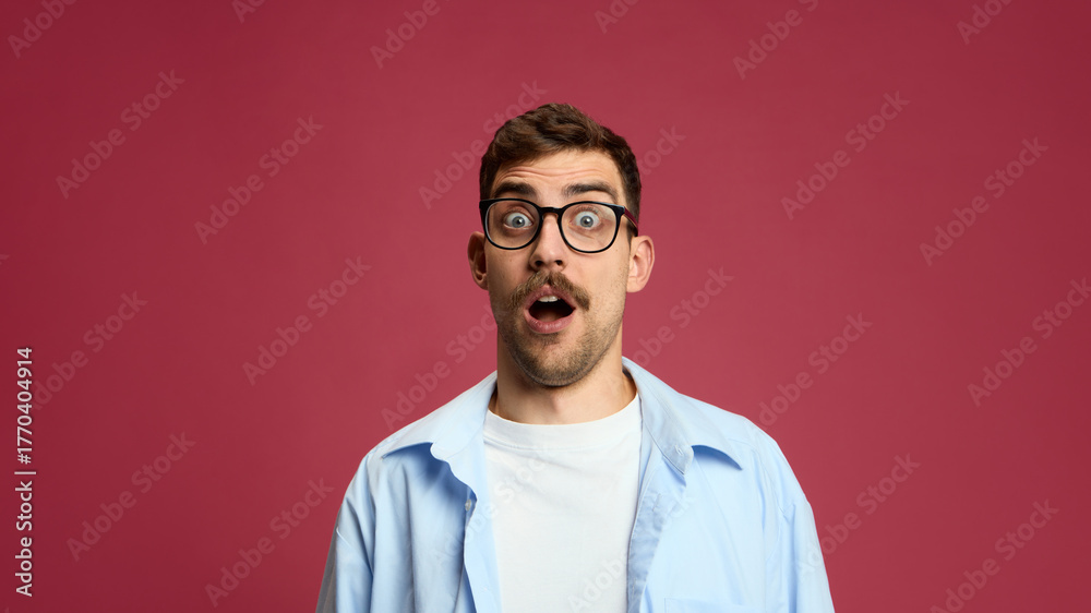 Shocked man with open mouth and wide eyes expressing disbelief and ...