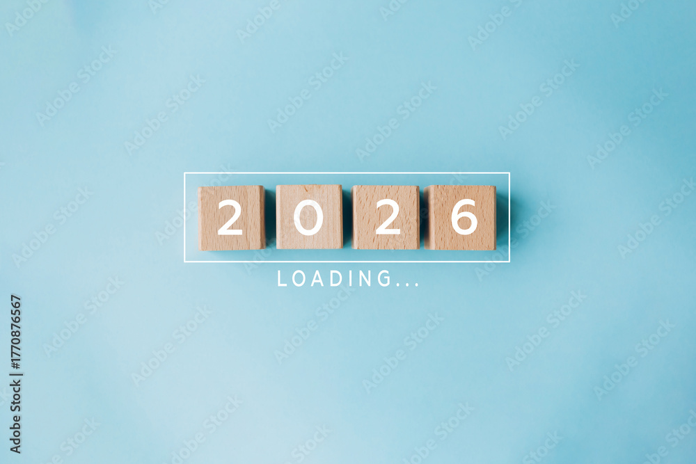 2026 loading concept with wooden cubes on blue background. Concept of ...