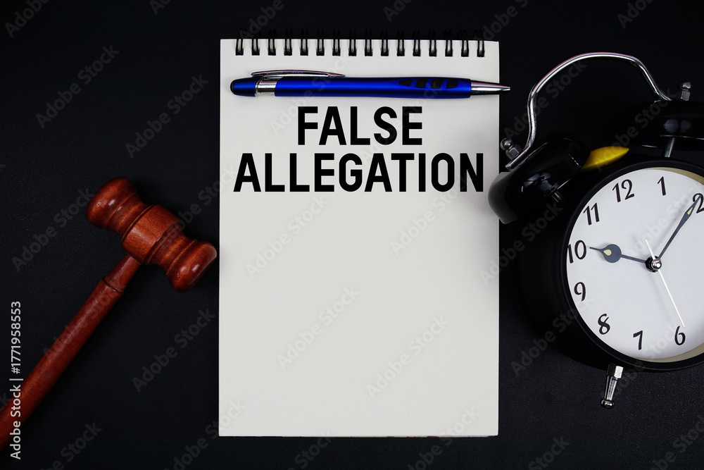 False Allegation text written on notepad with gavel and alarm clock on ...
