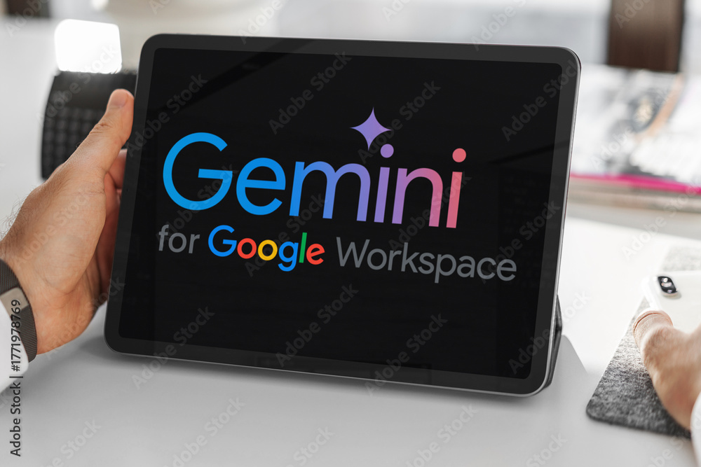 Hands holding tablet displaying gemini for google workspace logo の ...