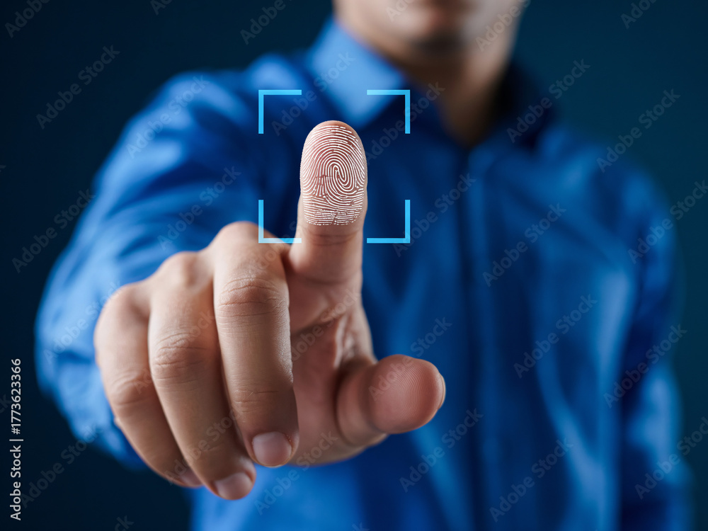 Man's finger with fingerprint scan engaged by digital frame for secure ...