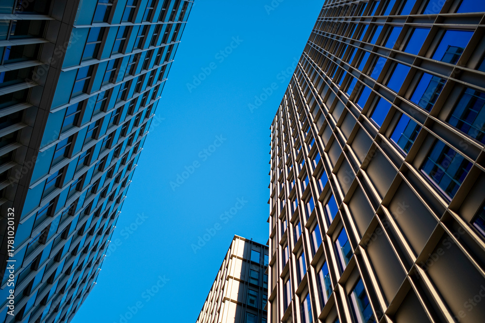 Modern city architecture seen upward with intersecting structure and ...
