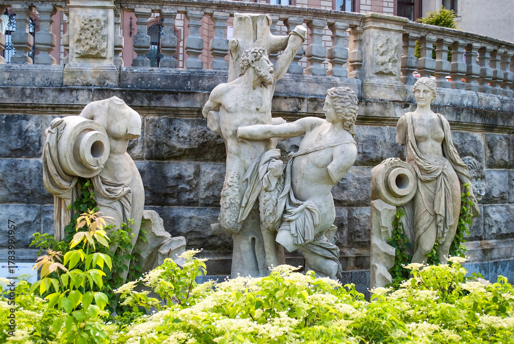 Baroque statues on the grounds of Moszna Castle in Poland. Stone ...