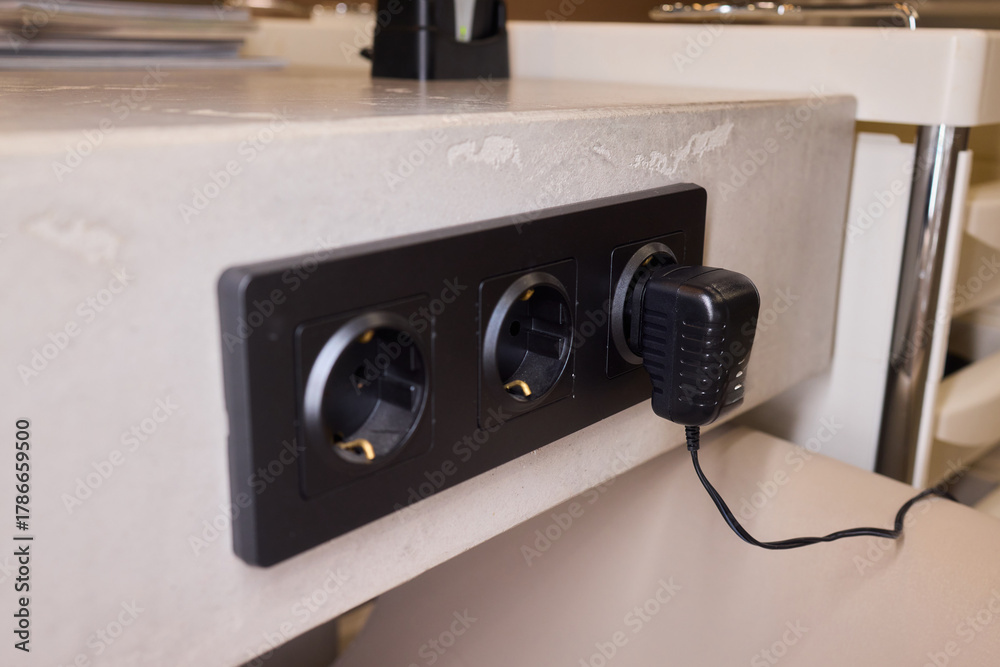 Power hub setup, Closeup of mounted power strip with multiple ...