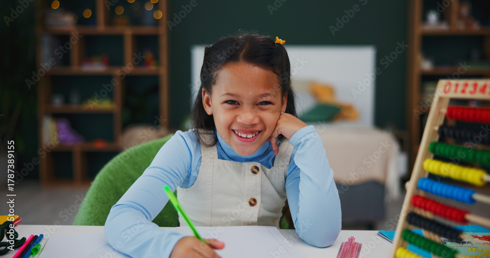 Happy, homework and portrait of girl in home for learning, education ...