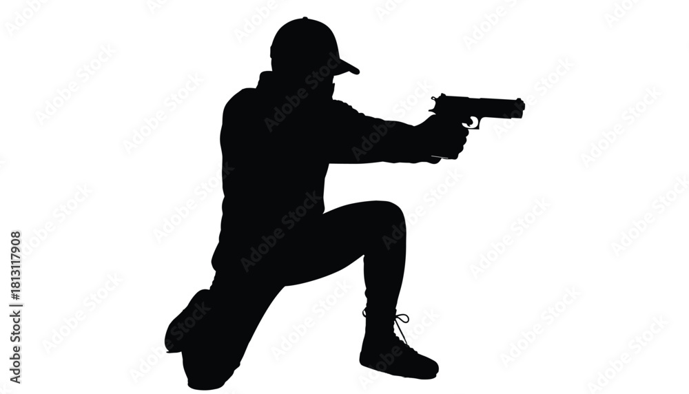 Silhouette of a police officer or soldier kneeling while aiming a ...