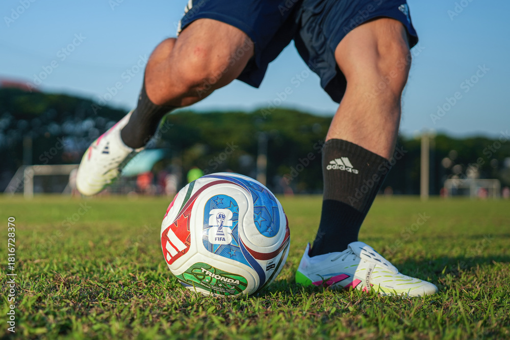 Bangkok, Thailand - 23 November 2025; A football player is training ...