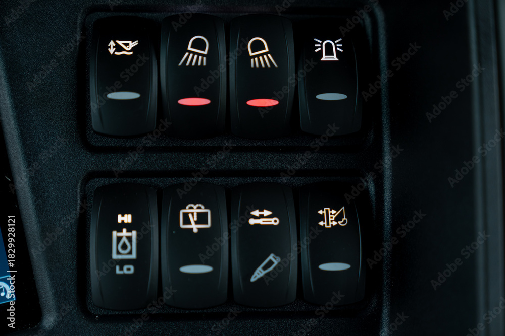 Detailed view of construction equipment switch panel featuring ...