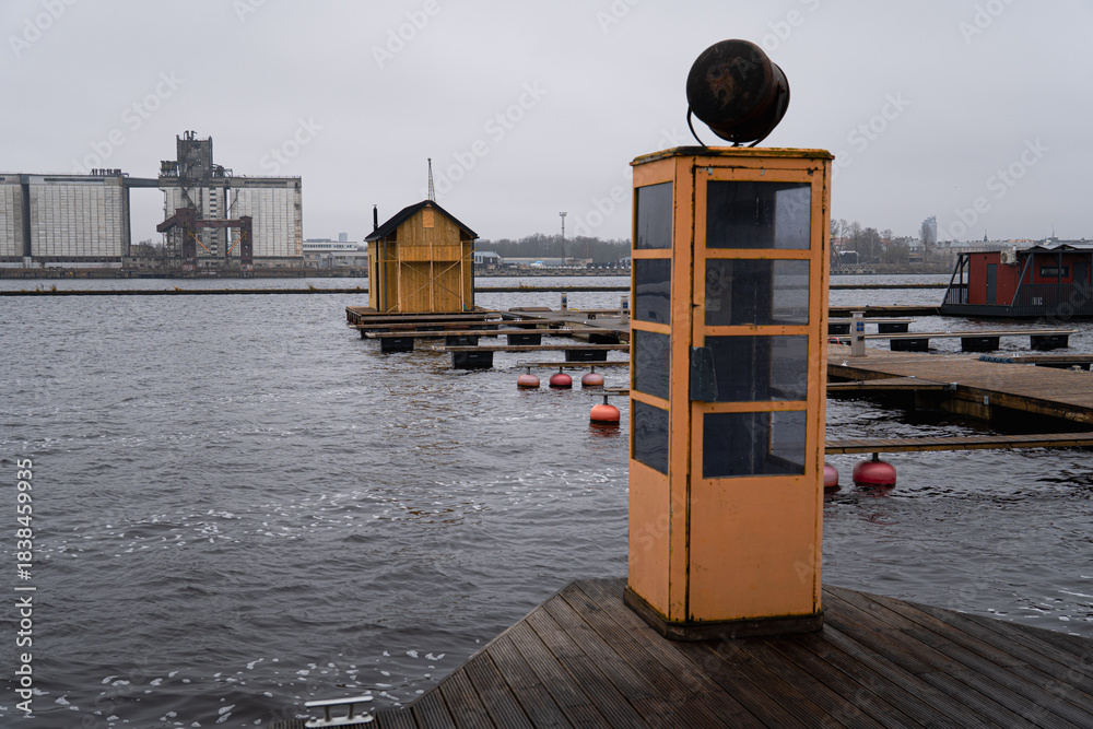 Soviet-Era Phone Booth at Empty Winter Marina with Industrial Silos ...
