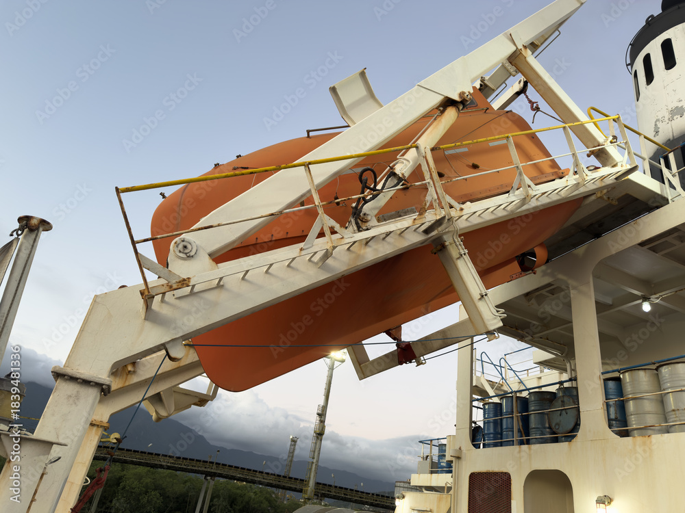 Foto de Stock Free fall lifeboat on cargo ship stern, maritime safety ...