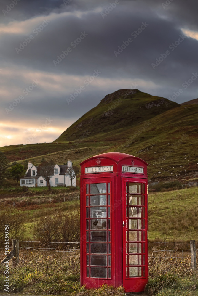 Red telephone booth next to the A855 road in Brogaig village at the ...