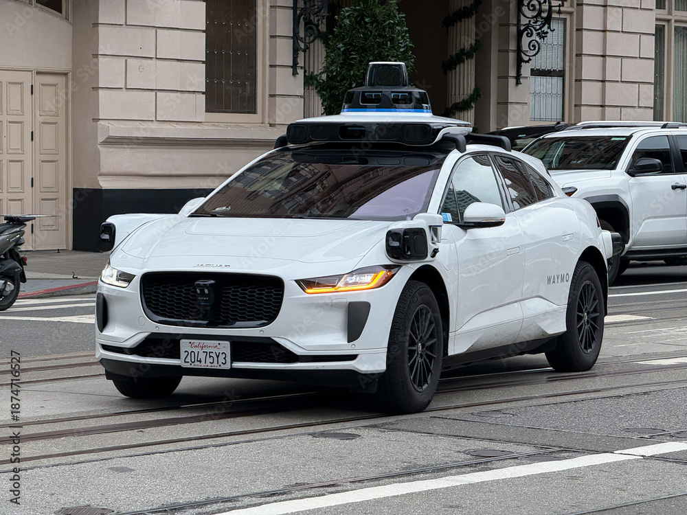 Waymo autonomous Jaguar I-PACE equipped with roof-mounted lidar sensors ...