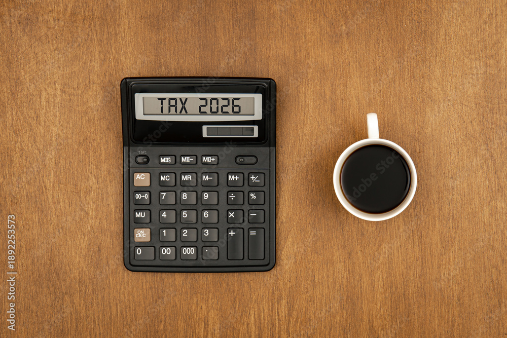 Stock-Foto „Calculator displaying TAX 2026 on desk for financial and ...