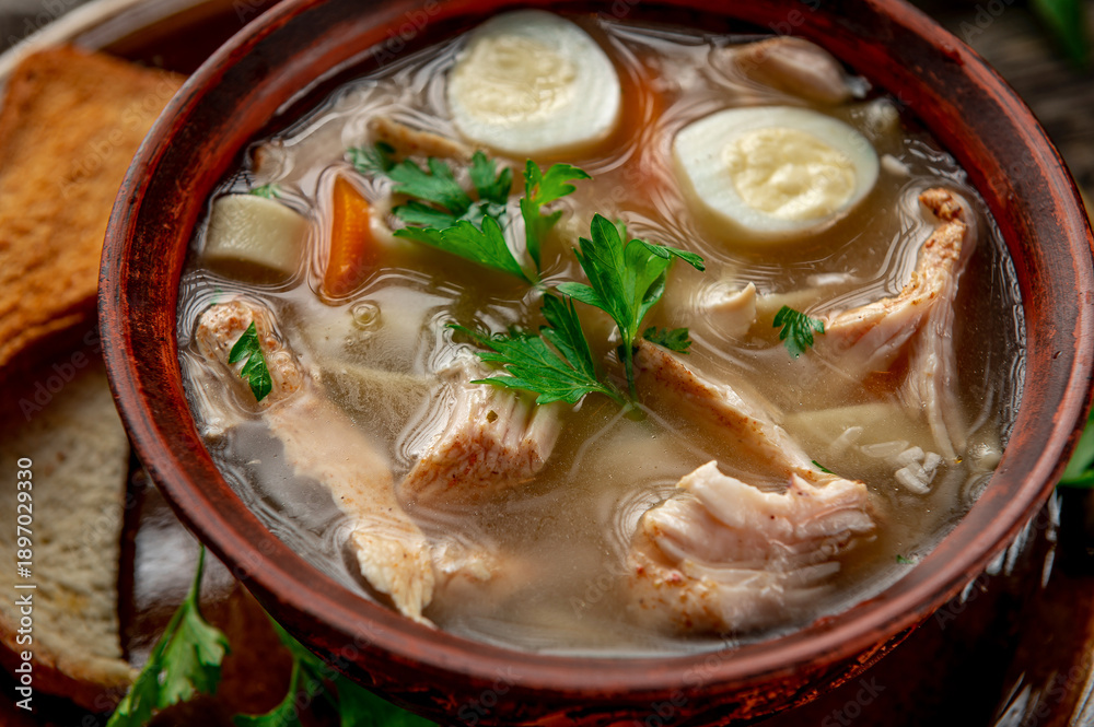Warm bowl of soup served with bread. A traditional bowl of soup with ...