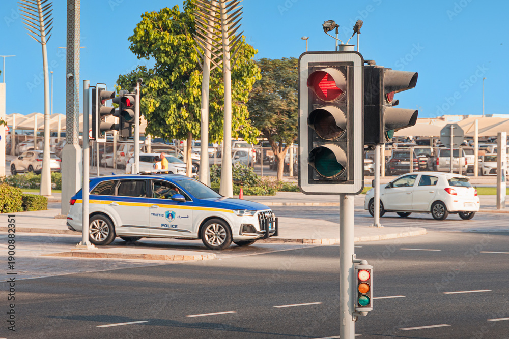 1 December 2025, Doha, Qatar: Police traffic patrol vehicle stopping at ...
