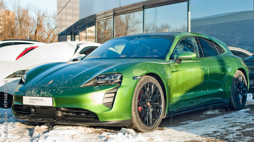 Photo Stock Riga, Latvia - February 8, 2026: A new green Porsche near a ...