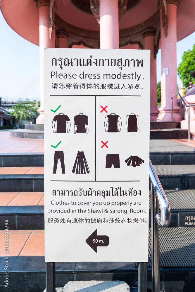Dress Code for temples in Thailand. A sign announcing the appropriate ...