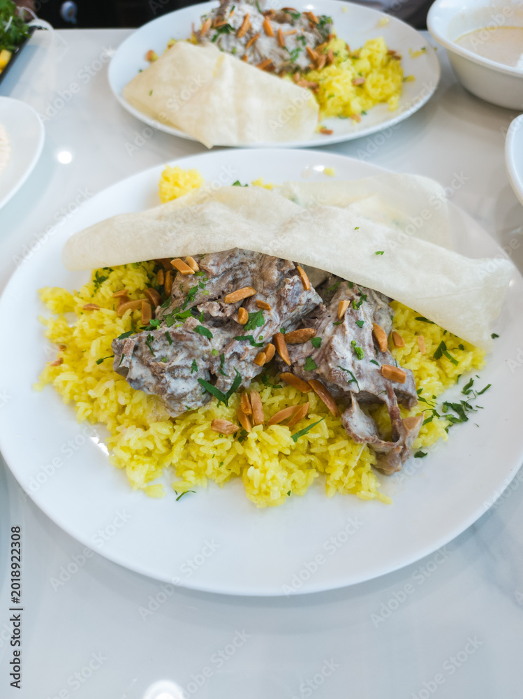 Jordanian Mansaf with Lamb Served on Yellow Rice and Crispy Bread の ...