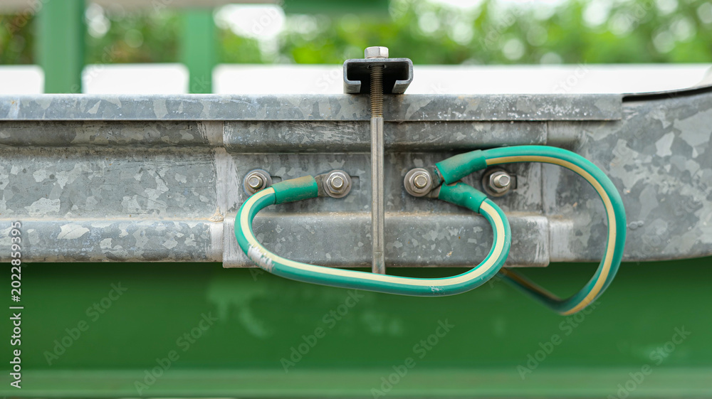 Ground bonding connects cable tray junctions in an industrial plant ...
