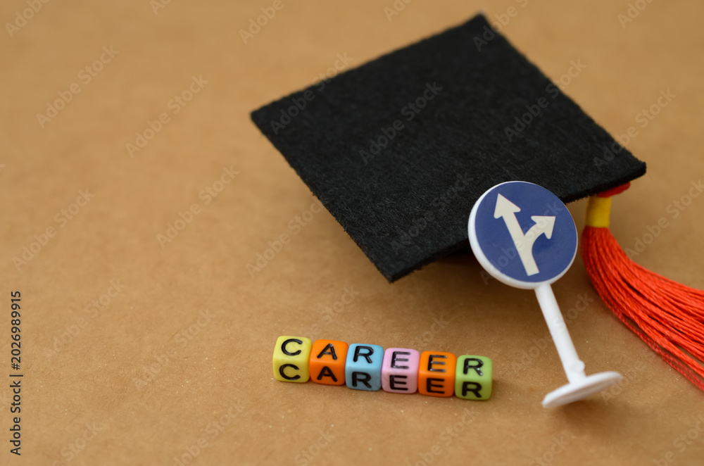 Career path choices and graduation concept with mortarboard and ...