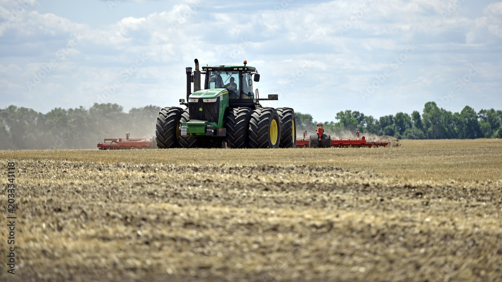 Kyiv, Ukraine, 19.07.2023. tractor in a field, tractor with a plow on ...