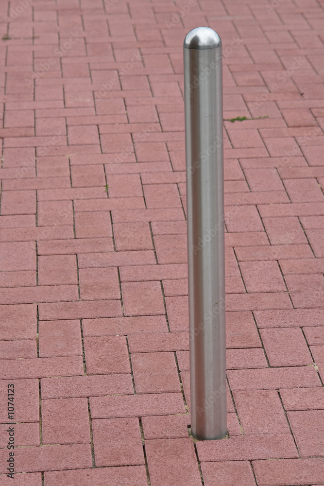 pfahl in pflaster Stock Photo | Adobe Stock