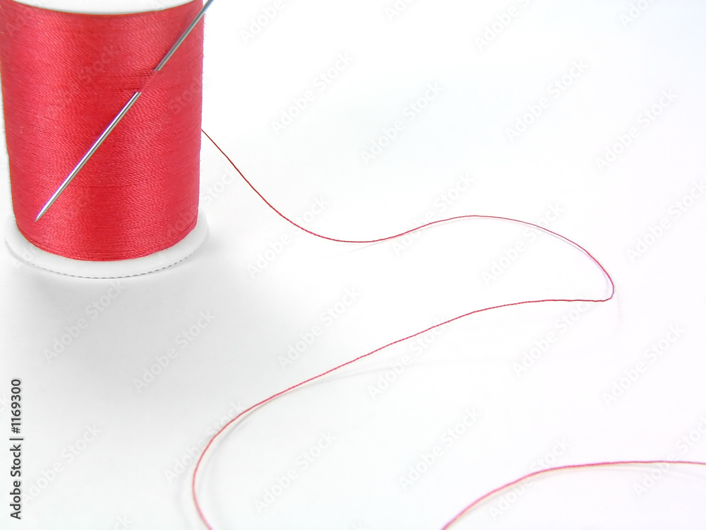 spool of red thread Stock Photo | Adobe Stock