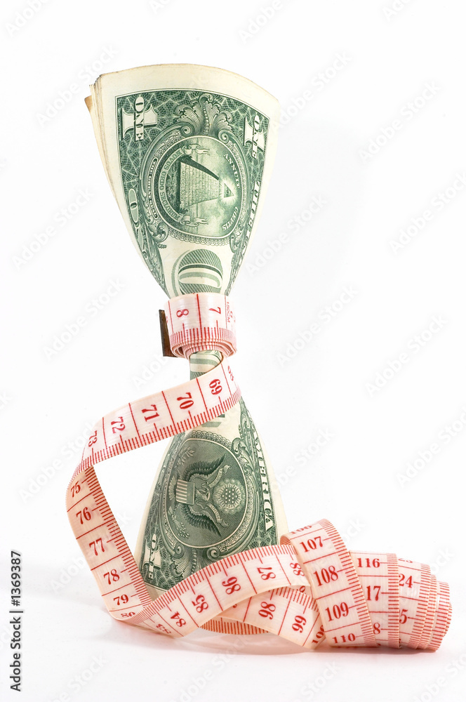 tight budgeting. upright money. Stock Photo | Adobe Stock