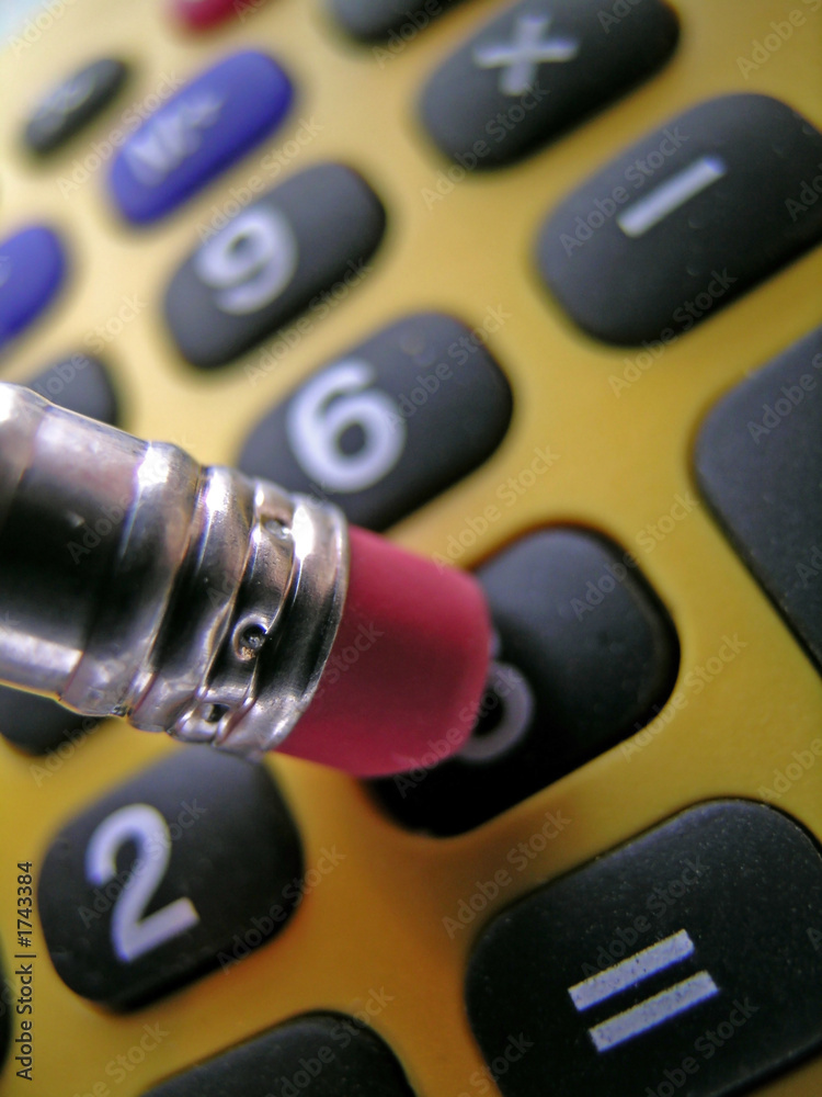 crunching the numbers on the calculator Stock Photo | Adobe Stock