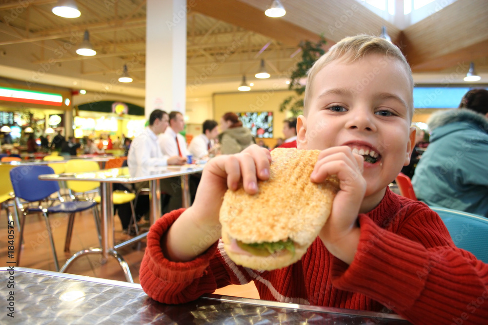 child eat burger Stock Photo | Adobe Stock