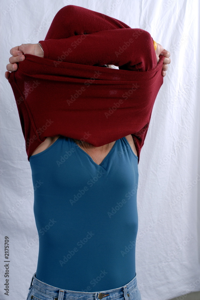 woman pulling top off Stock Photo | Adobe Stock