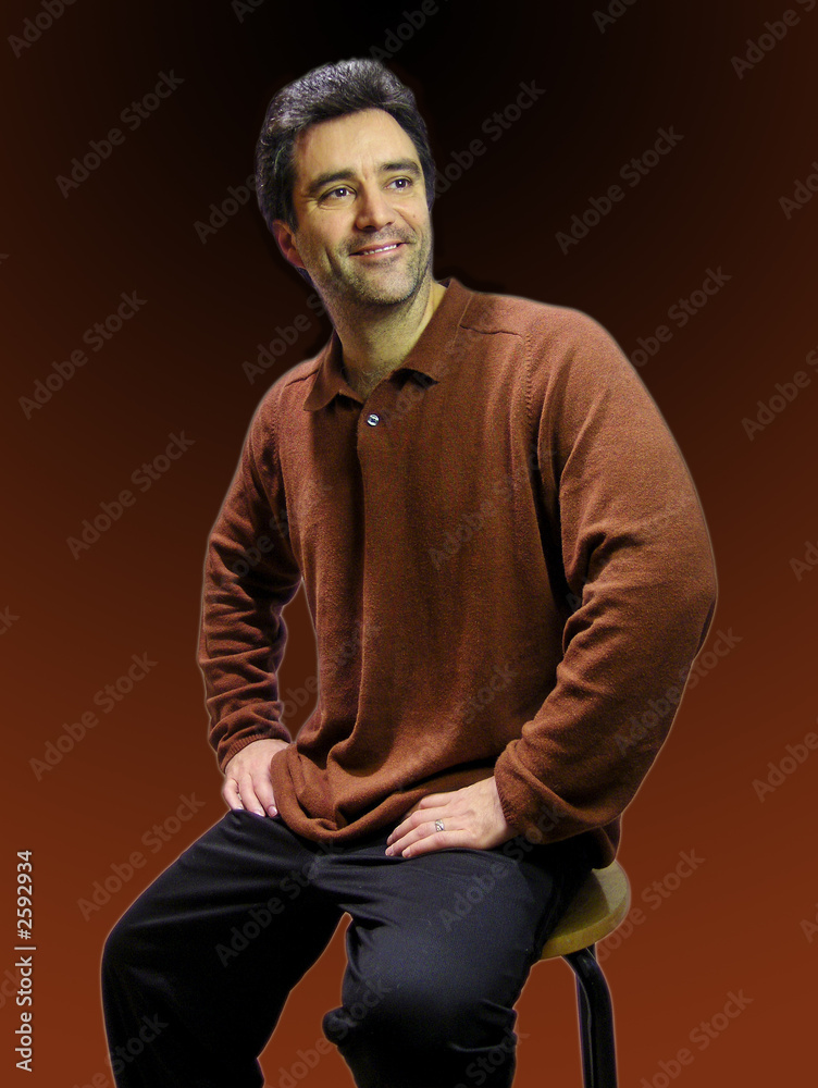 handsome man sitting on a stool Stock Photo | Adobe Stock