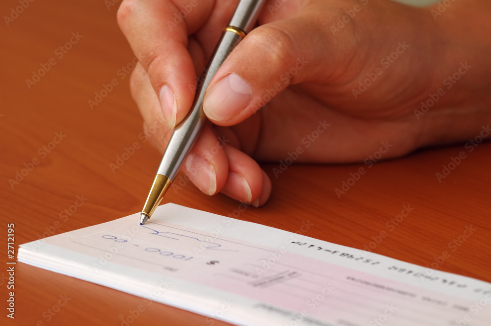 signing a money cheque Stock Photo | Adobe Stock