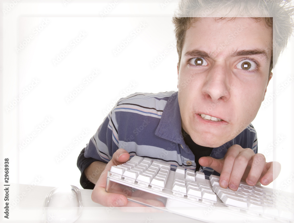 teenage boy frustrated with computer Stock Photo | Adobe Stock