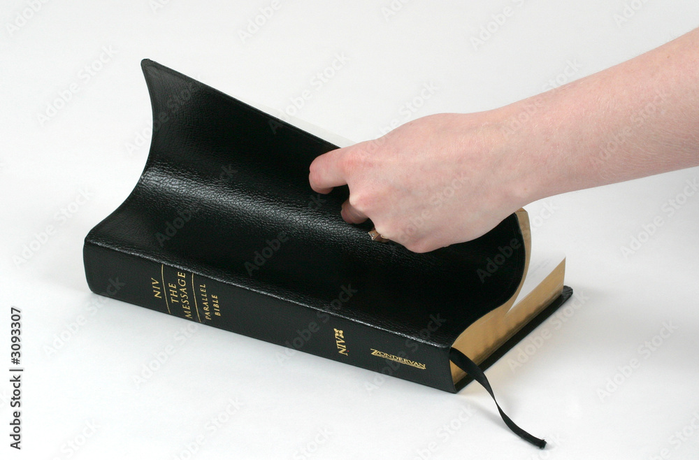 opening the cover on the bible Stock Photo | Adobe Stock