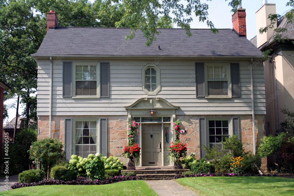 Two storey middle class home with siding and shutters Stock Photo ...
