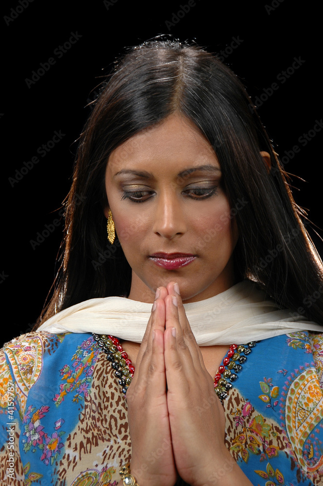 Indian lady in traditional attire praying Stock Photo | Adobe Stock
