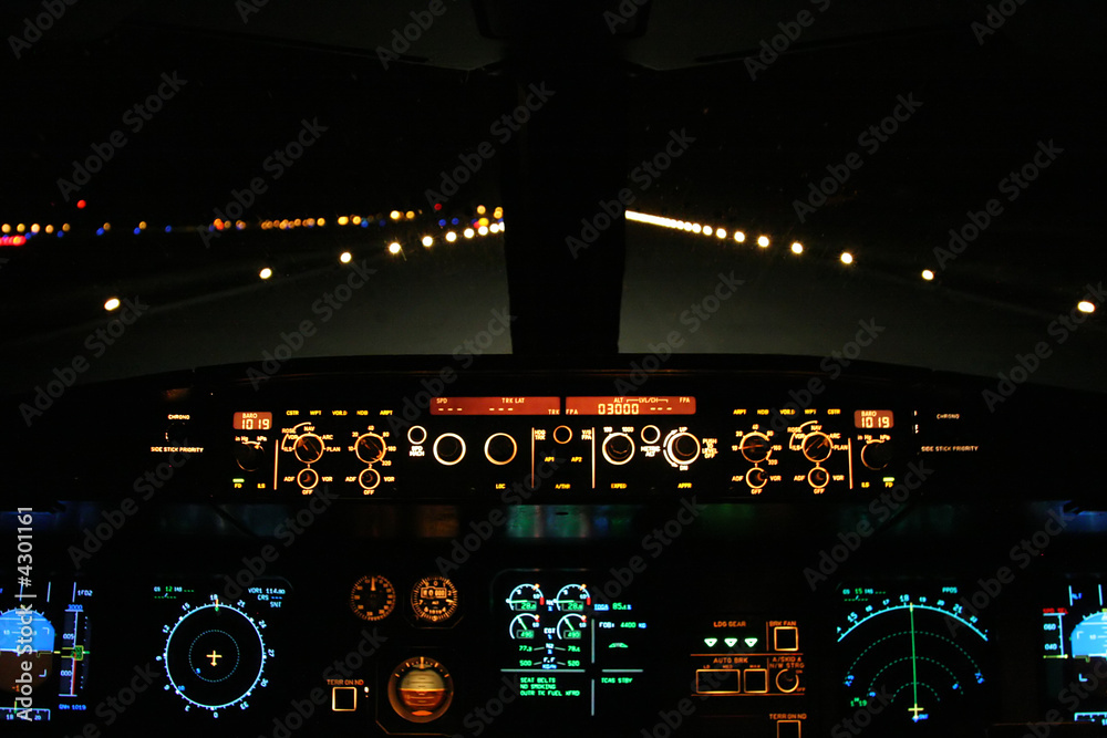 aircraft landing at night with runway ahead Stock Photo | Adobe Stock