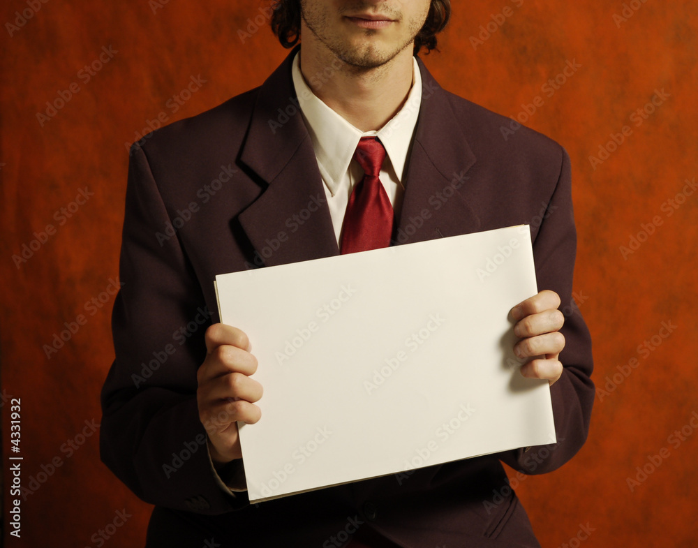 Young men wearing suit holding a blank sign Stock Photo | Adobe Stock