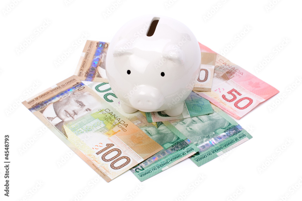 Piggy Bank and canadian dollars Stock Photo | Adobe Stock