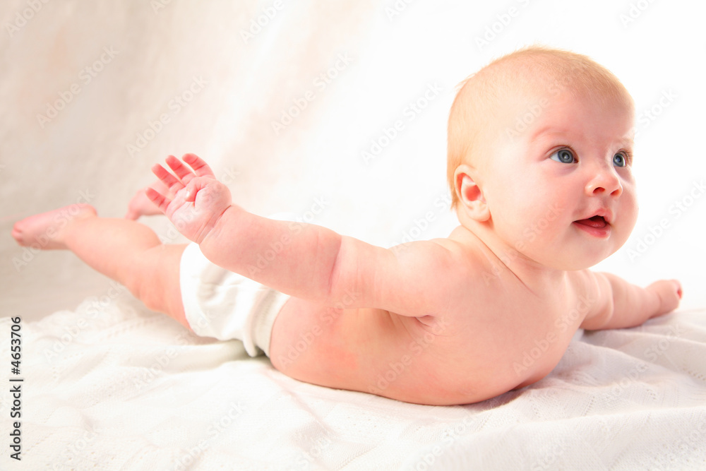 baby in 'flying' pose Stock Photo | Adobe Stock