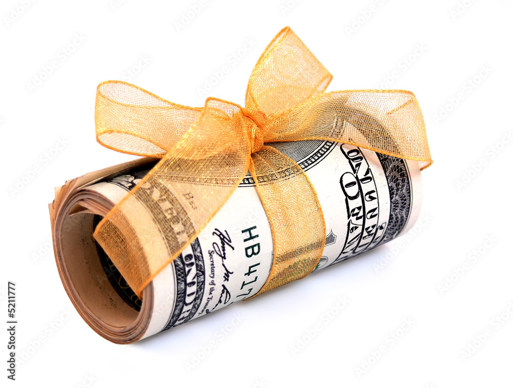 Money roll wrapped in a golden ribbon Stock Photo | Adobe Stock