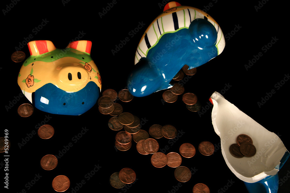 broken bank spilling out pennies Stock Photo | Adobe Stock