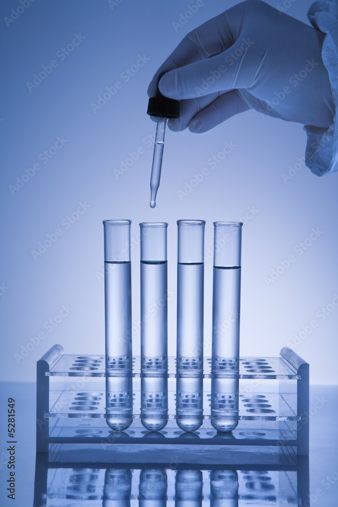 Hand holding dropper. Stock Photo | Adobe Stock