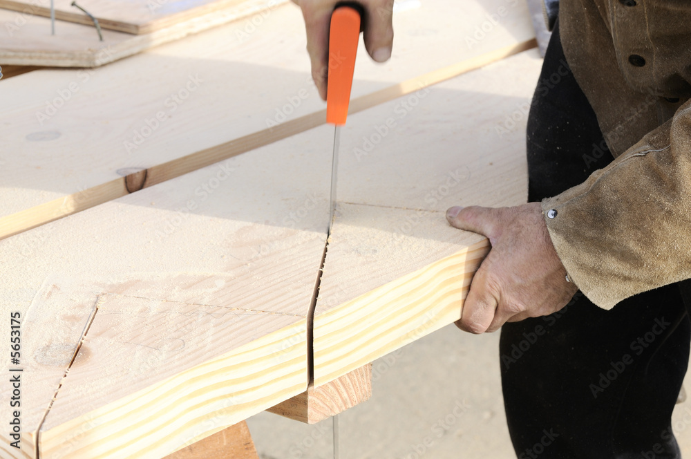 Carpenter finishing cut on steps for a stringer Stock Photo | Adobe Stock
