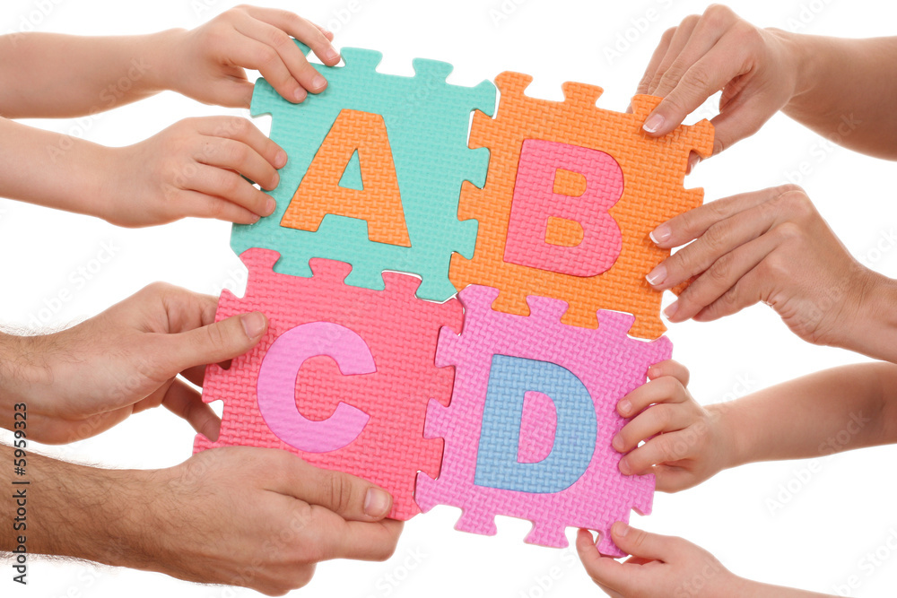 hands holding puzzle with ABCD letters isolated on white Stock Photo ...