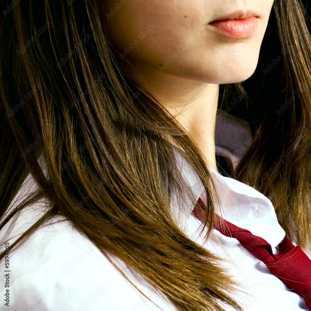 Girl wearing red necktie Stock Photo | Adobe Stock